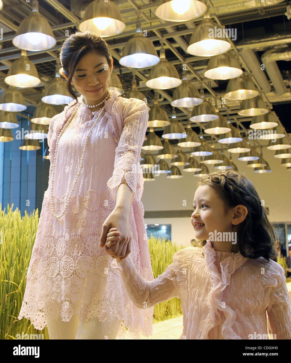 Jan. 22, 2011 - Tokyo, Japan - Models display the creation designed by ...