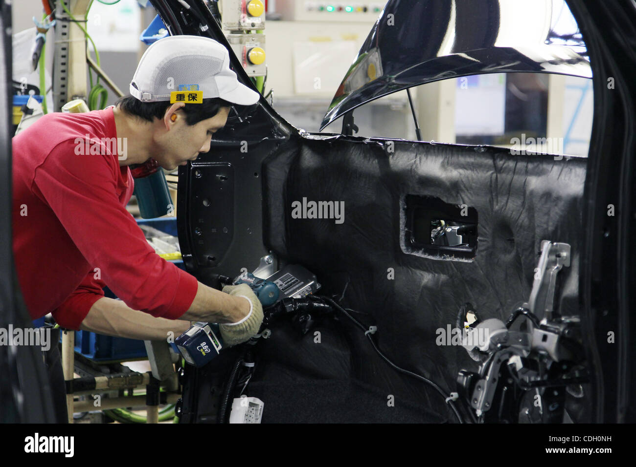 Jan. 24, 2011 - Tokyo, Japan - Employees of Nissan work in the assemble ...