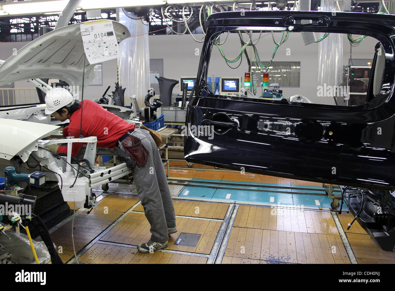 Jan. 24, 2011 - Tokyo, Japan - Employees of Nissan work in the assemble ...