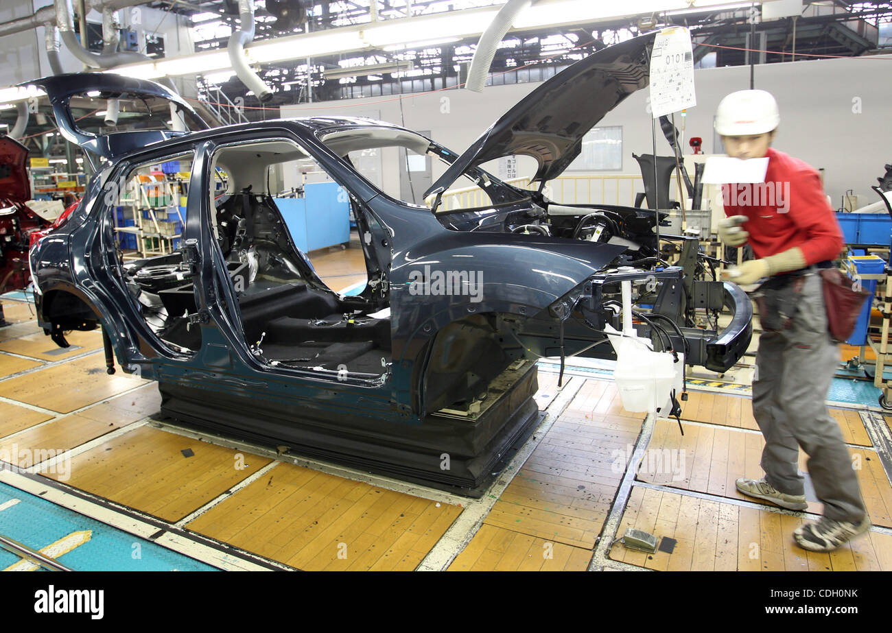 Jan. 24, 2011 - Tokyo, Japan - Employees of Nissan work in the assemble ...