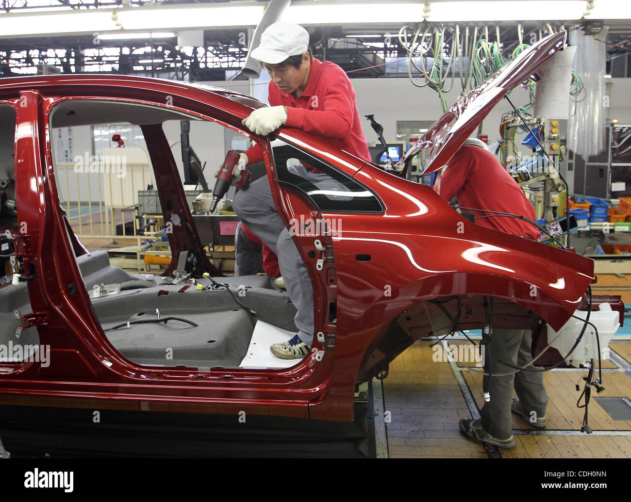 Jan. 24, 2011 - Tokyo, Japan - Employees of Nissan work in the assemble ...