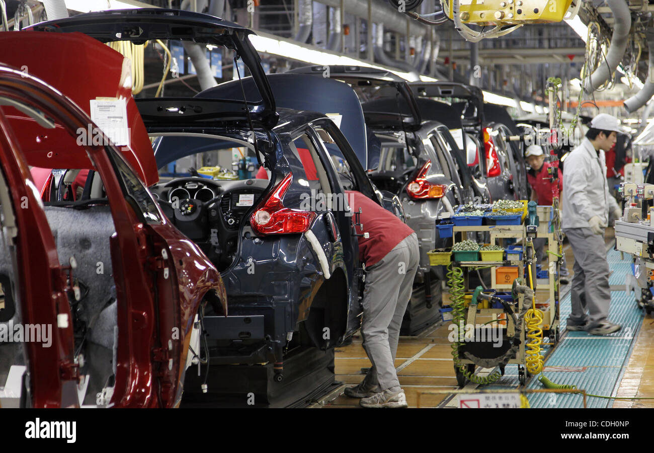 Jan. 24, 2011 - Tokyo, Japan - Employees of Nissan work in the assemble ...