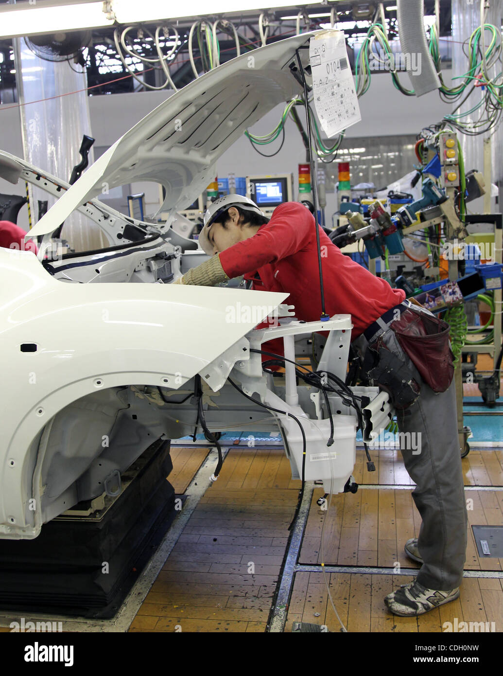 Jan. 24, 2011 - Tokyo, Japan - Employees of Nissan work in the assemble ...
