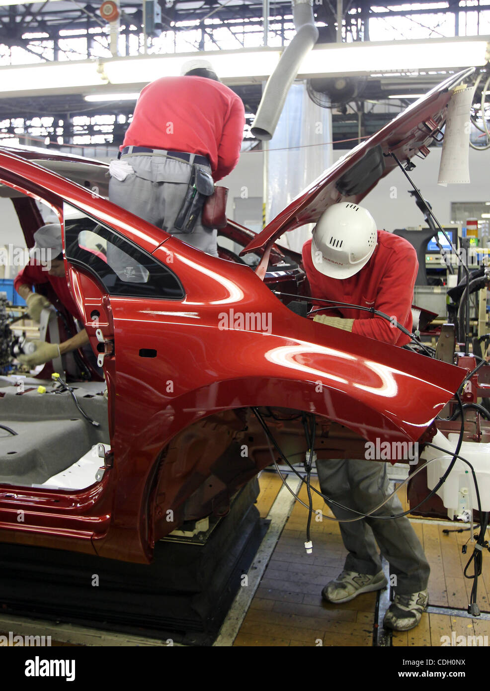 Jan. 24, 2011 - Tokyo, Japan - Employees of Nissan work in the assemble ...