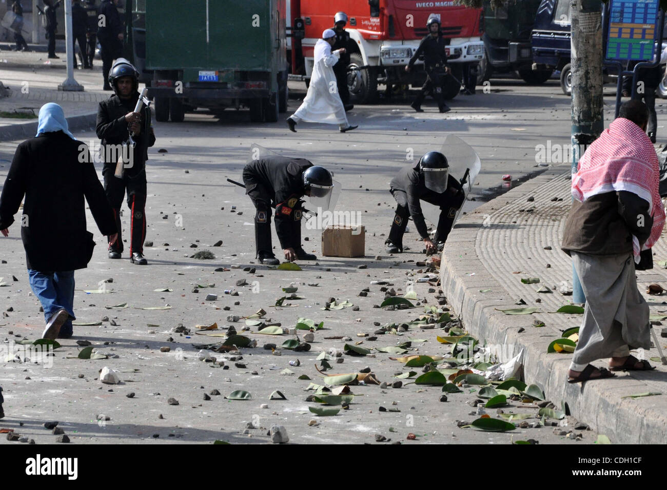Egyptian police stand guard during fresh demonstrations that erupted ...