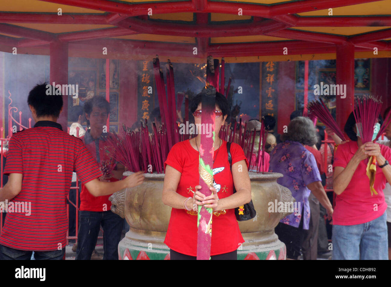 Indonesian Chinese pray at at the the Jin De Yuan temple, locally known ...