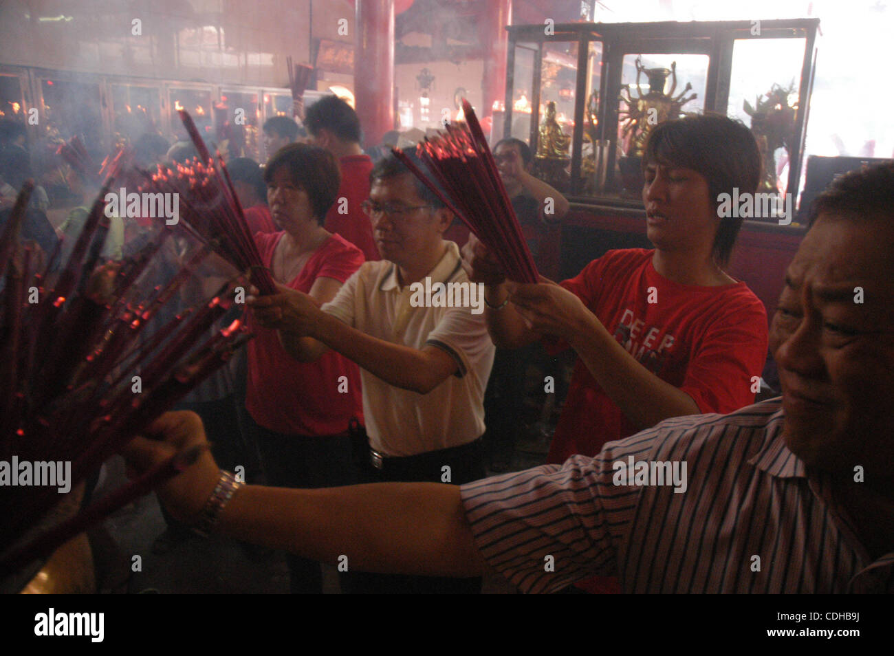 Indonesian Chinese pray at at the the Jin De Yuan temple, locally known ...