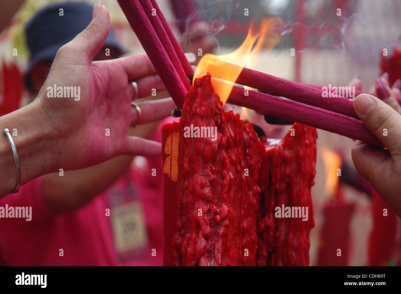 Indonesian Chinese pray at at the the Jin De Yuan temple, locally known ...