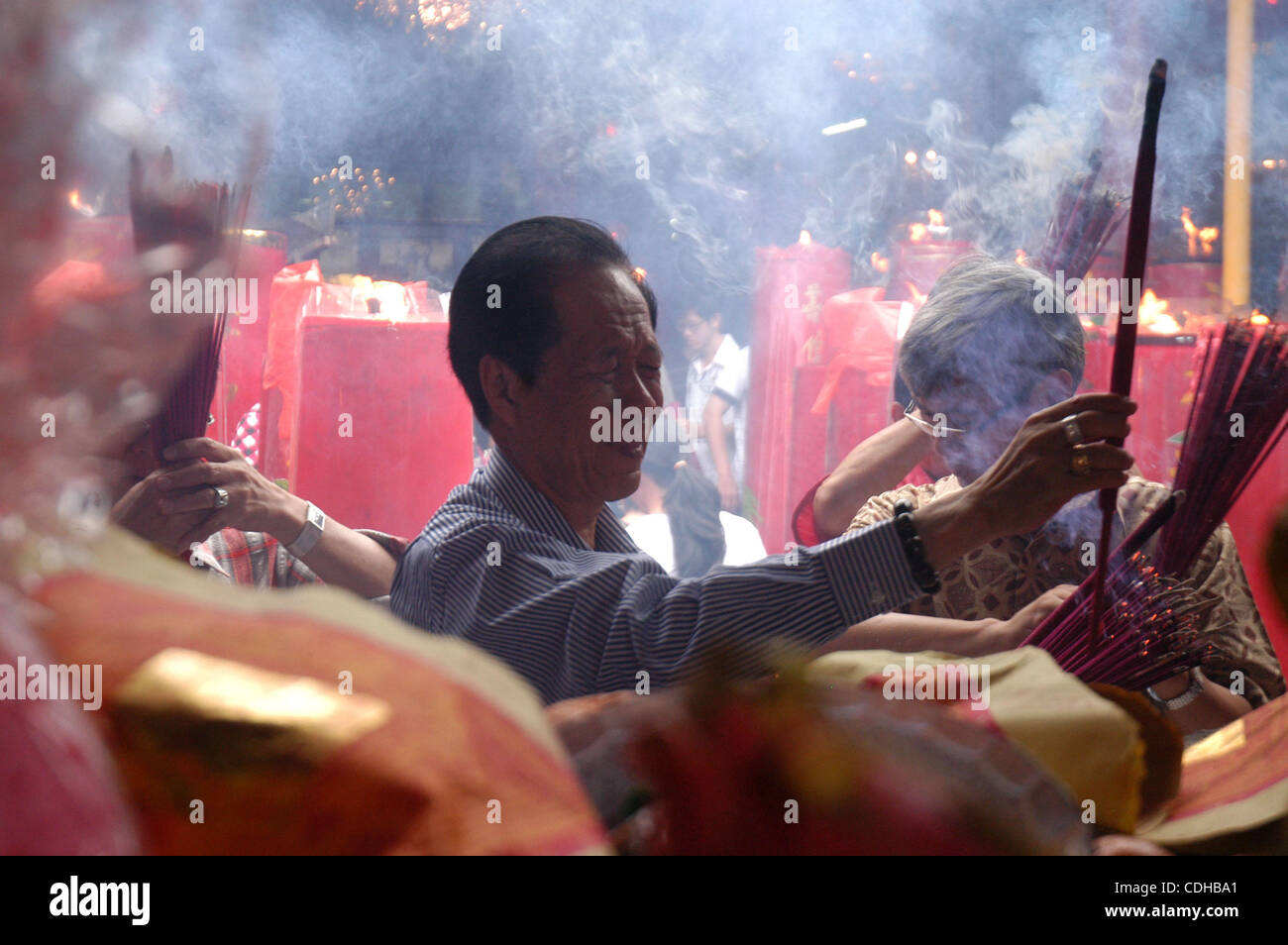 Indonesian Chinese pray at at the the Jin De Yuan temple, locally known ...