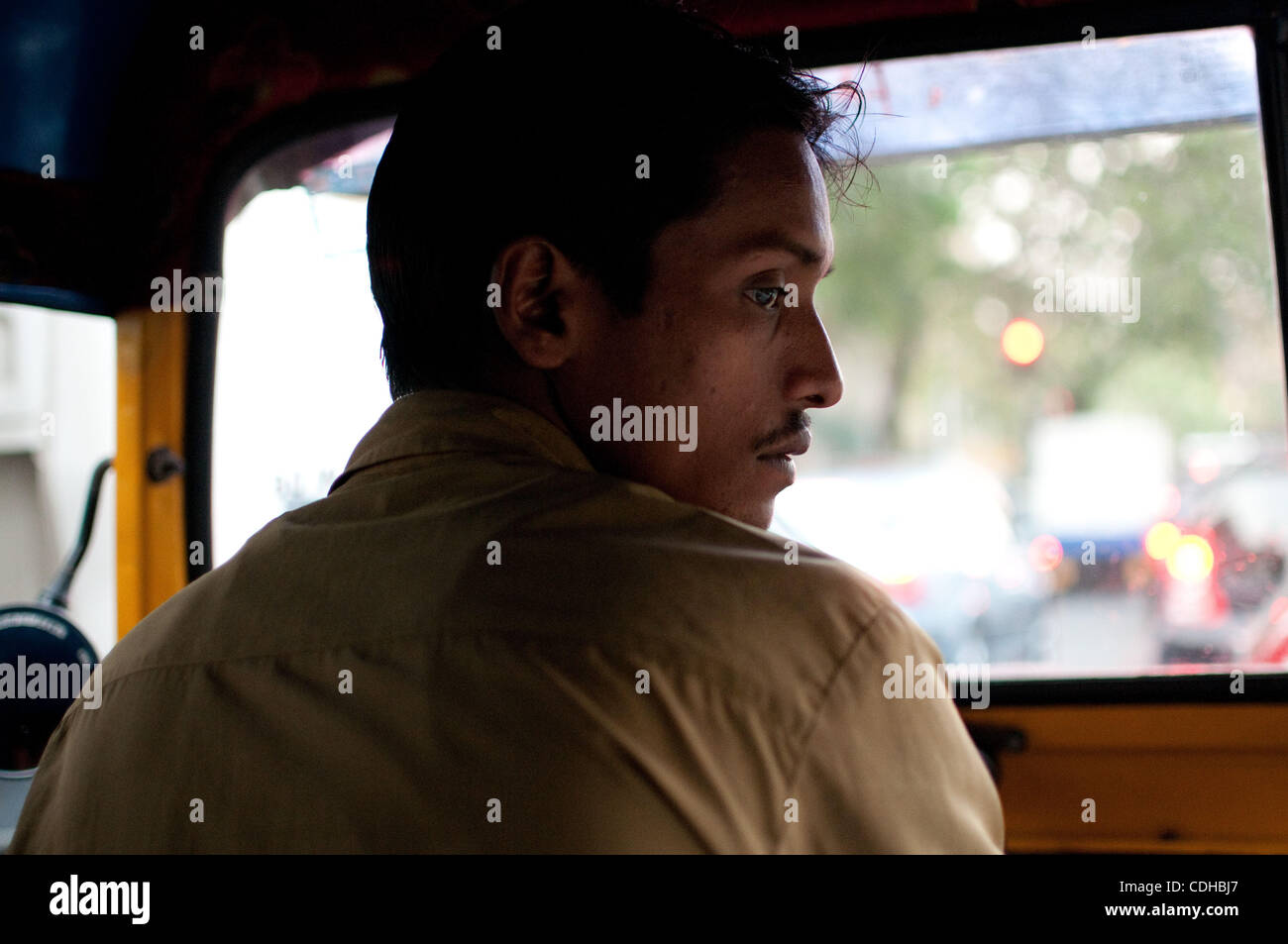 A rickshaw driver turns around at a red light in Mumbai, India Stock ...