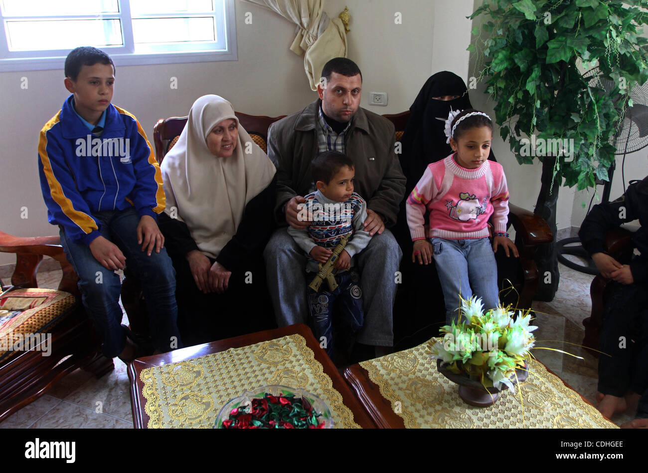 Ayman Nofal (C), a top Hamas armed commander, sits with his family at ...