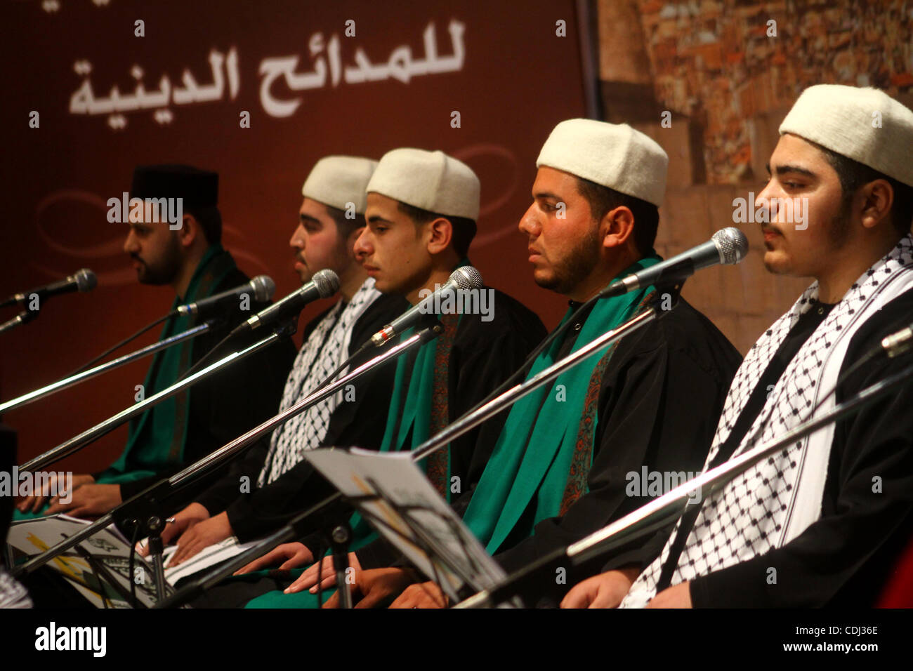 Palestinian youths sing Islamic songs during a ceremony commemorating ...