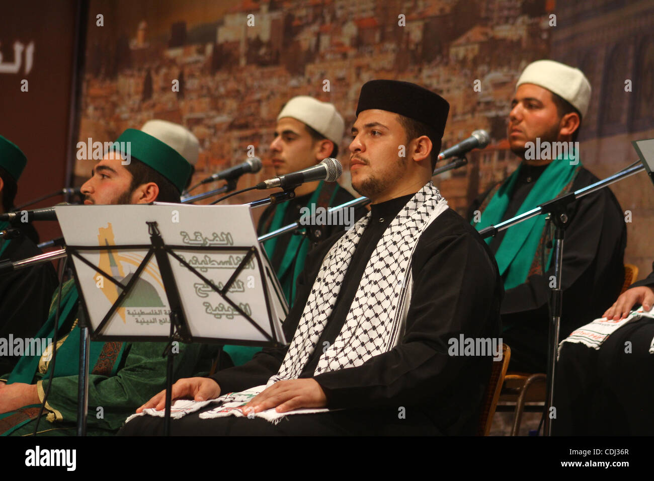 Palestinian youths sing Islamic songs during a ceremony commemorating ...