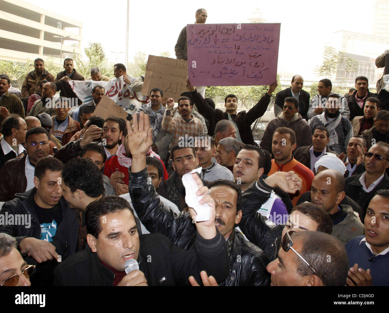 Egyptian protesters take part in a rally in front of the postal ...