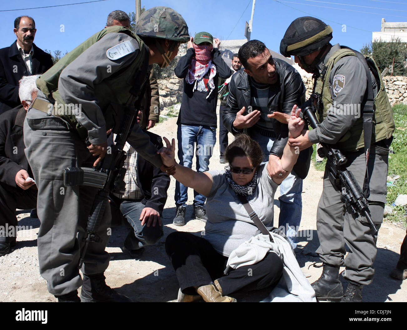 Israeli soldiers argue with Palestinian, Israeli and International ...