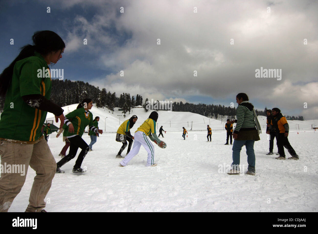 School Girls playing snow rugby during snow festival at Gulmarg valley ...