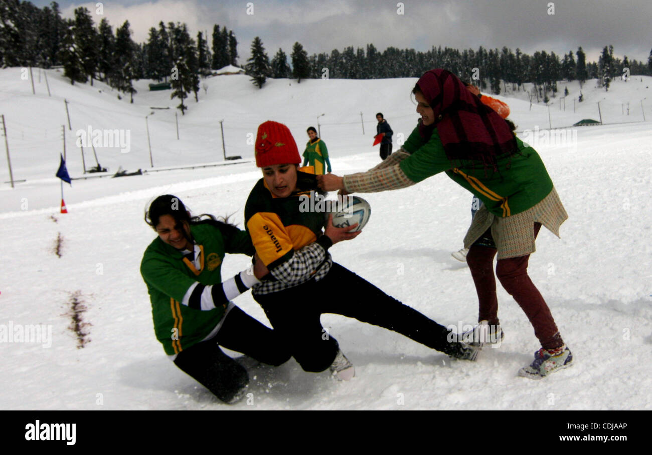 School Girls playing snow rugby during snow festival at Gulmarg valley ...