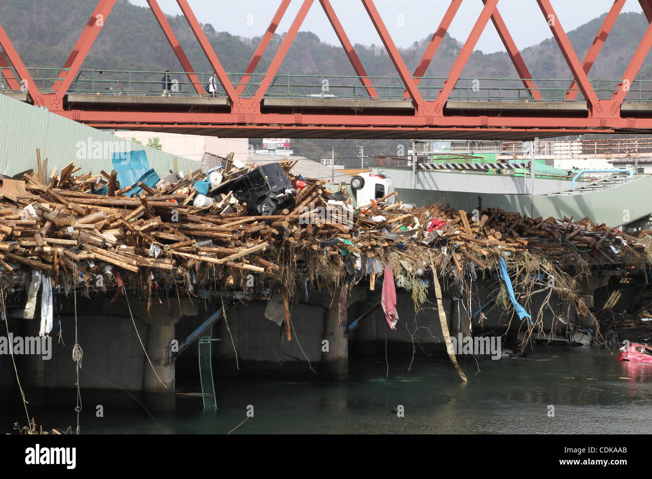 Mar. 14, 2011 - Kamaishi, Japan - Rubble is piled up on a bridge in ...