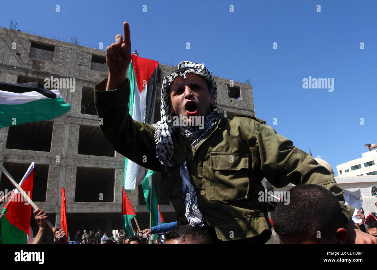 A Palestinian dressed like late Palestinian leader Yasser Arafat shouts ...