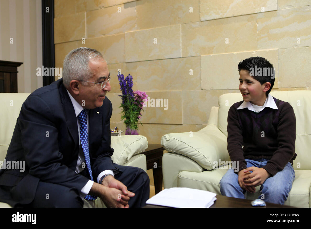 Palestinian Prime Minister Salam Fayyad meets the child Issam Bashiti ...