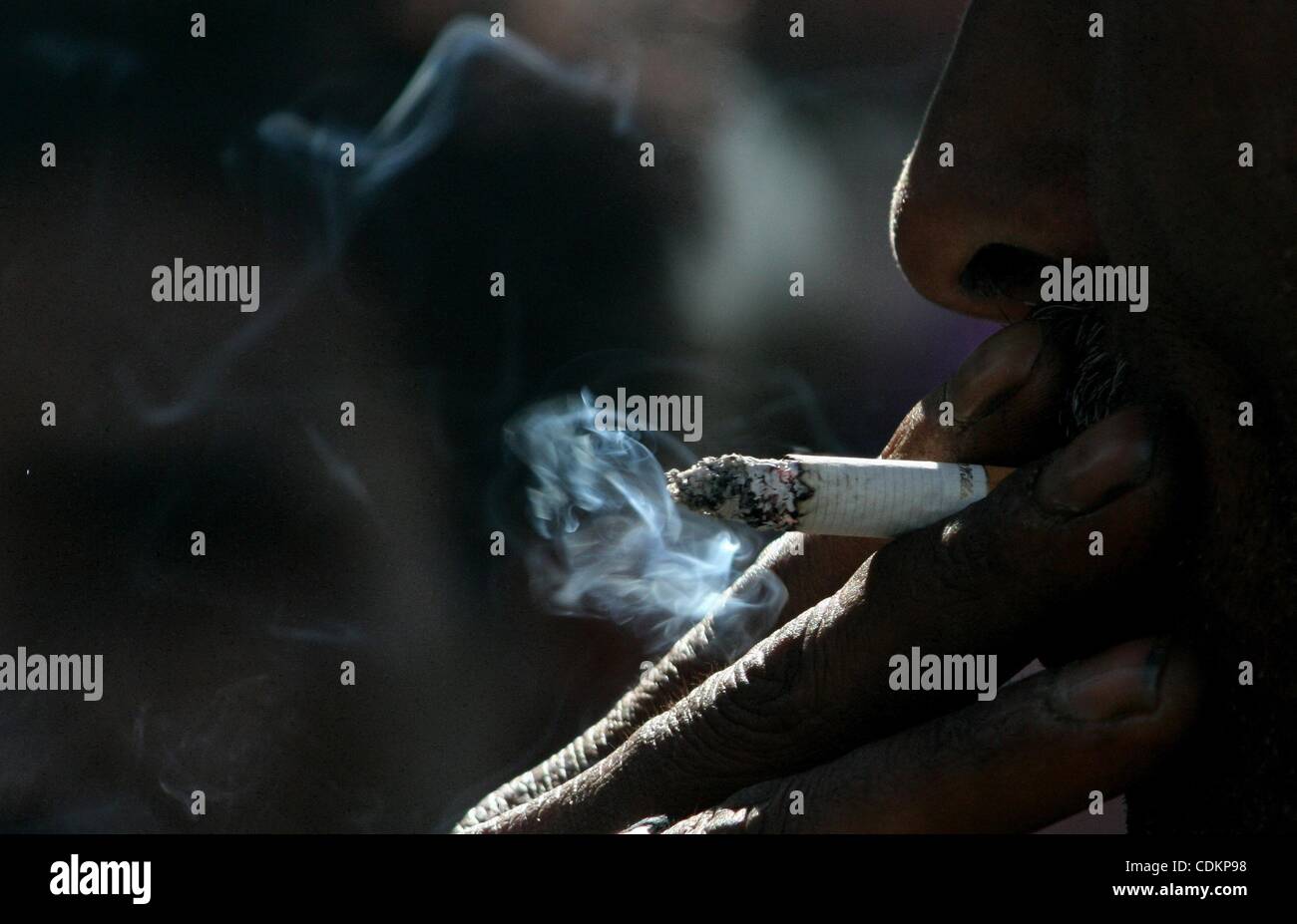 Mar 24, 2011 - Srinagar, Kashmir, India - A person smokes cigarette on ...