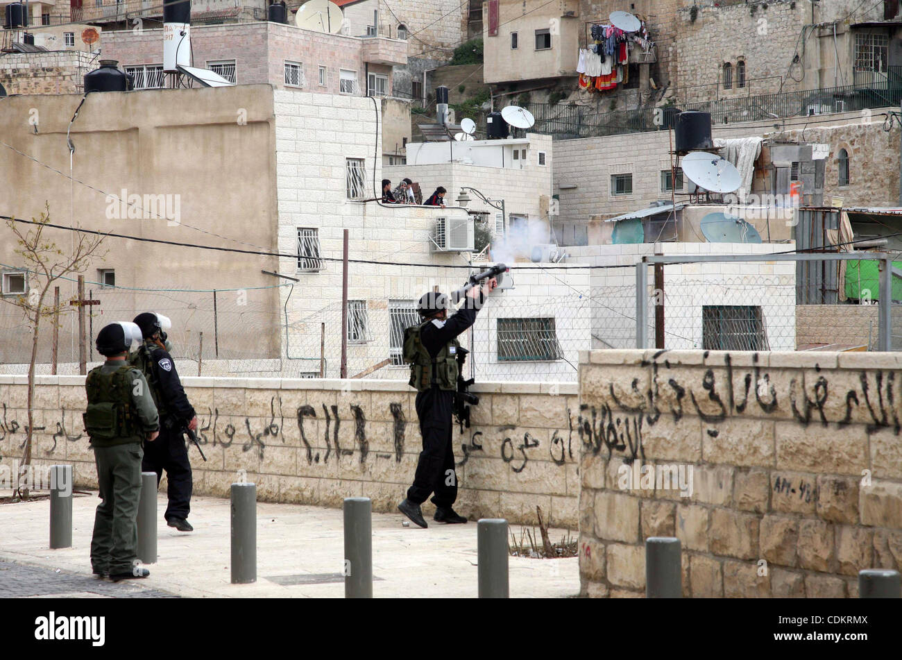 Israeli Border Police fire tear gas towards Palestinian stone throwers ...