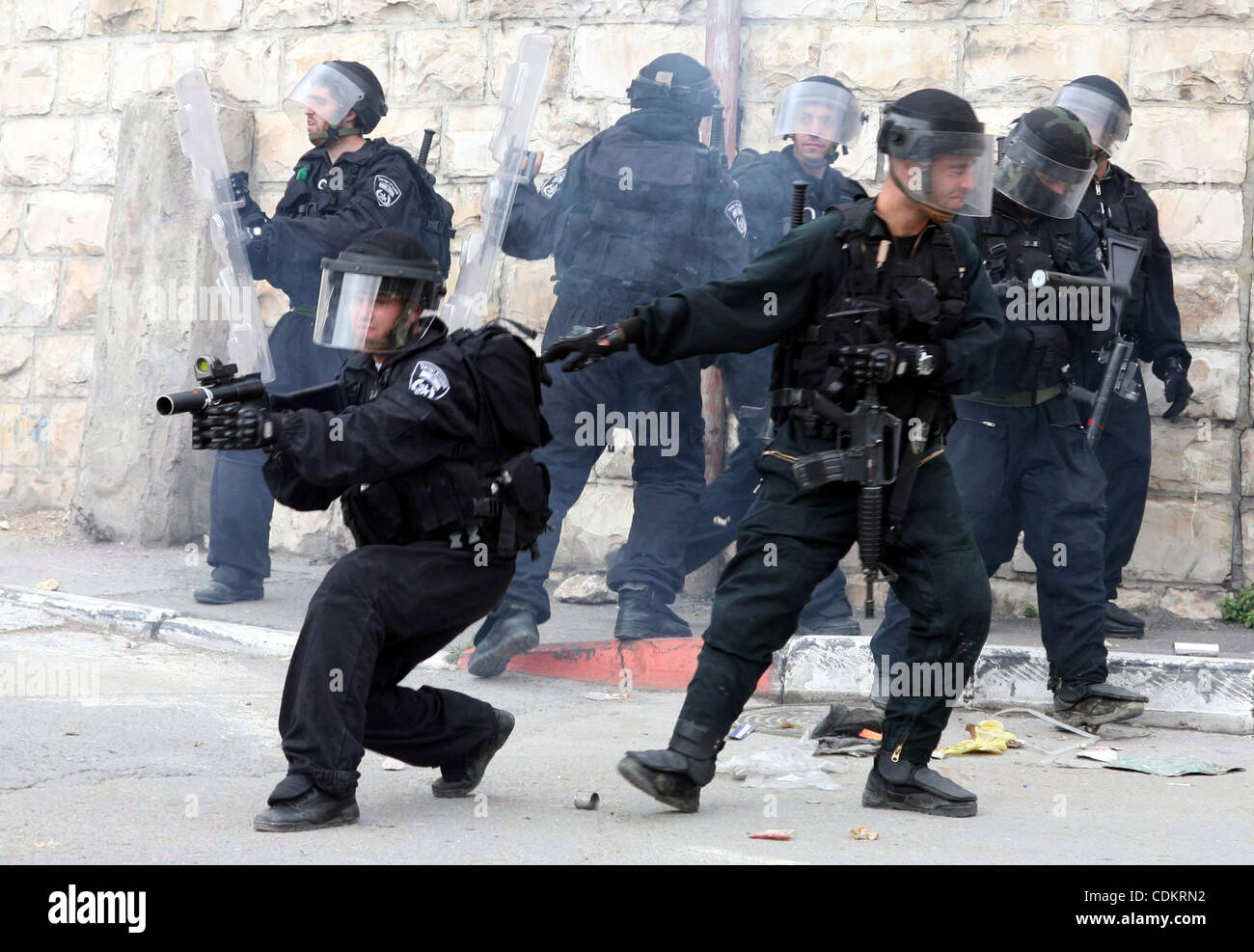 Israeli Border Police fire tear gas towards Palestinian stone throwers ...