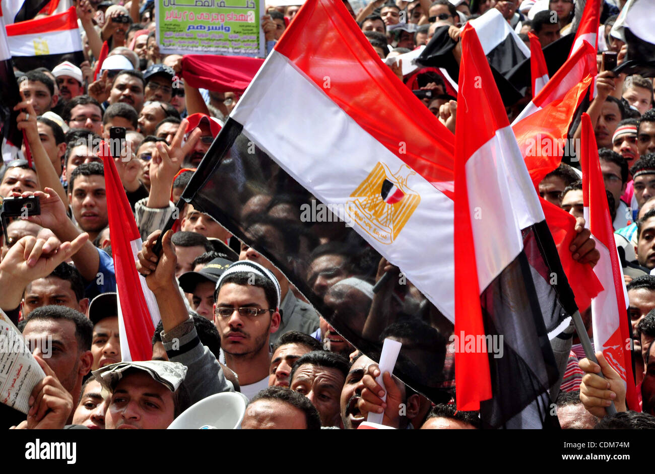 Egyptian protesters participate in a demonstration at the Tahrir square ...
