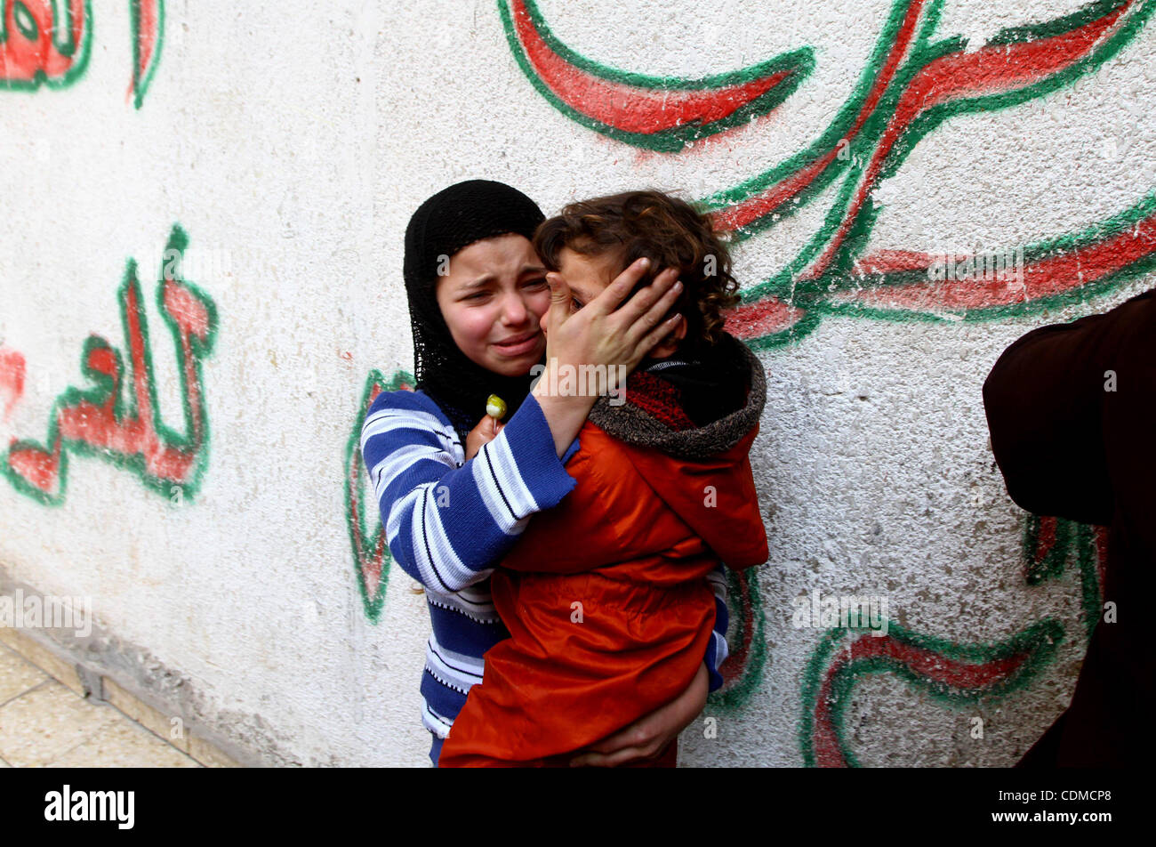 Relatives of Palestinian Mohammed Shalha react during his funeral in ...