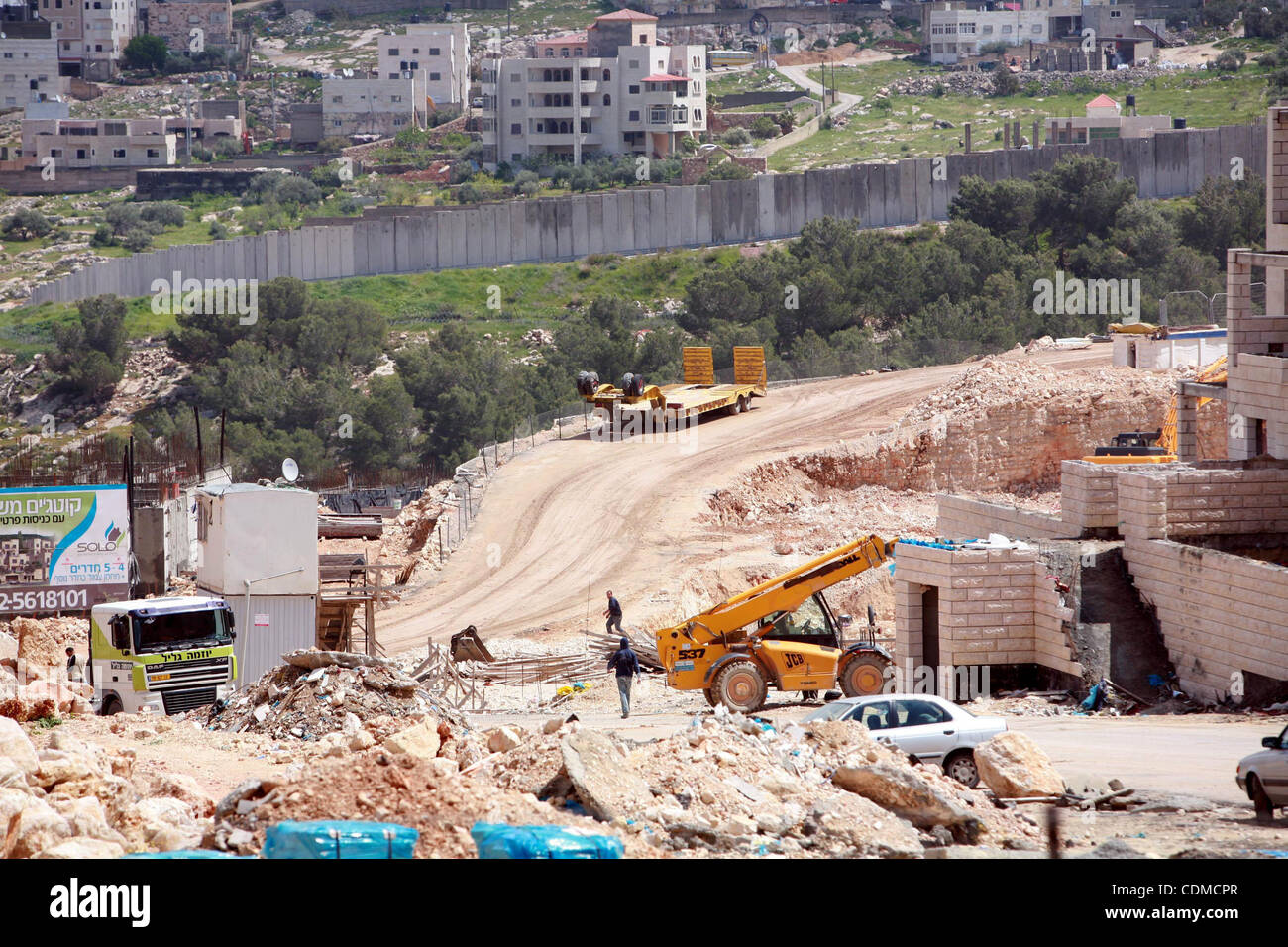 Israeli bulldozers work in the jewish settlement of Pisgat Zeev in East ...