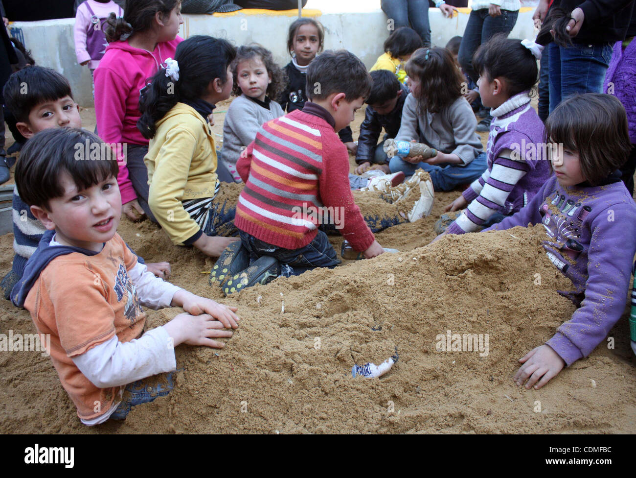 Palestinian children take part in playing festival ( All Together with Children) at Child ...