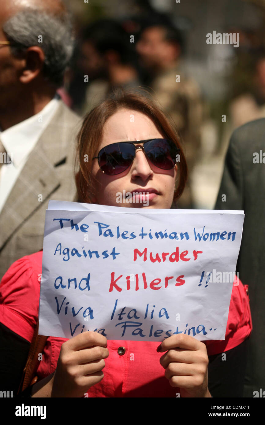 Palestinians hold slogans against the kidnapping and killing of an ...