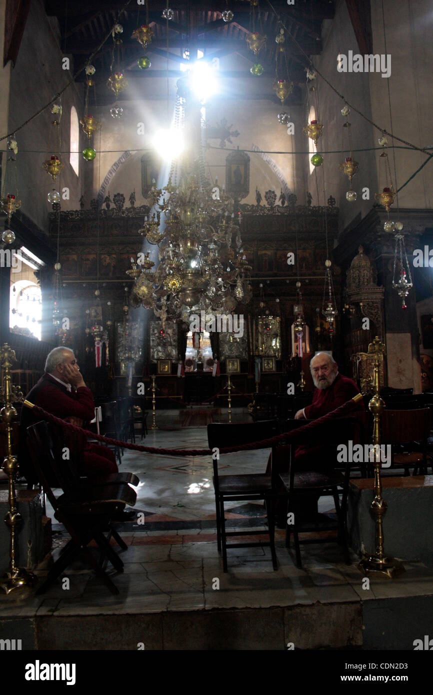 Apr 24, 2011 - Bethlehem, West Bank - Christian's seated near a shaft ...