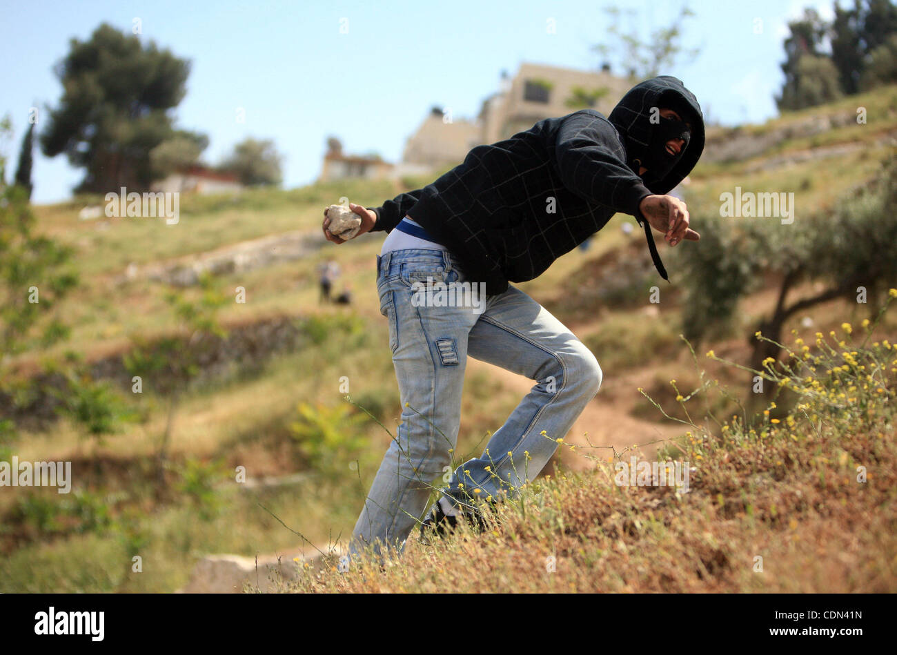 Palestinian youths hurl stones toward Israeli soldiers during clashes ...