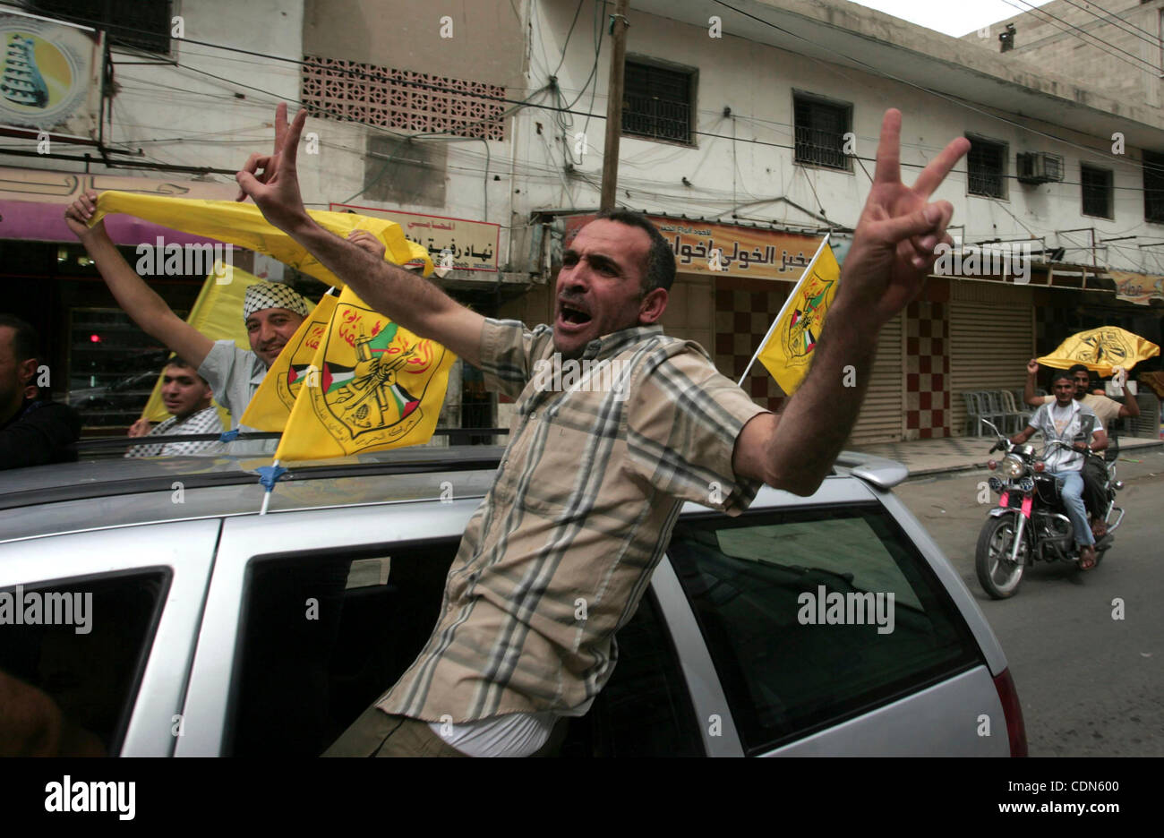 Palestinians wave with Fatah party flags during a rally celebrating the ...