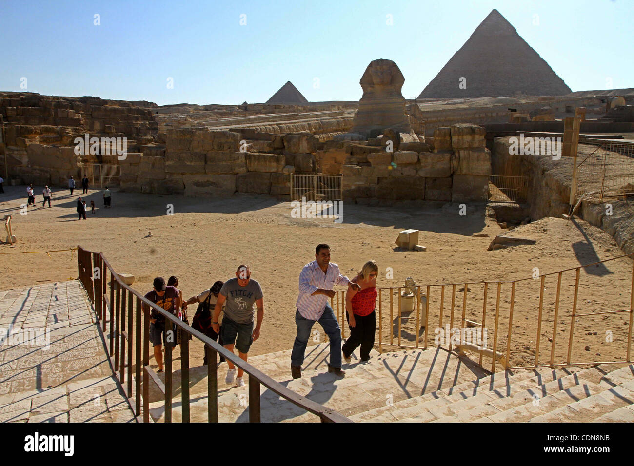 Foreign tourists visits the Giza Pyramids at the outskirts of Cairo ...