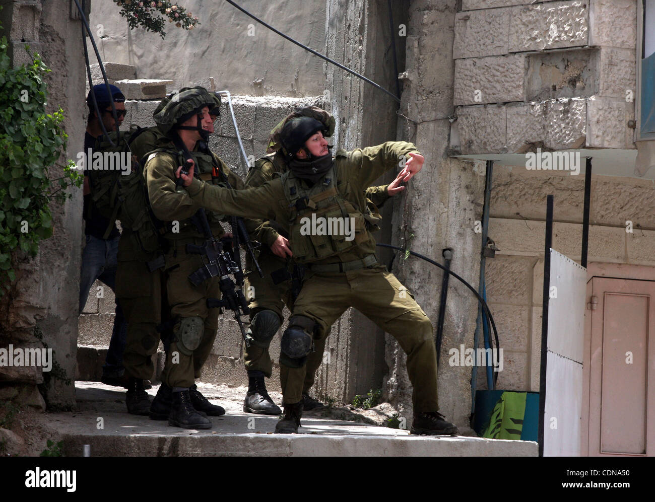 Israeli soldiers fire tear gas canisters during clashes with stone ...