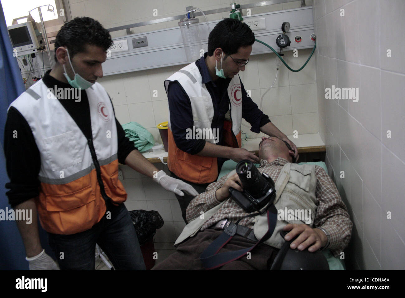 A Palestinian photographer Najeh Hashlamoun receive treatment at a ...