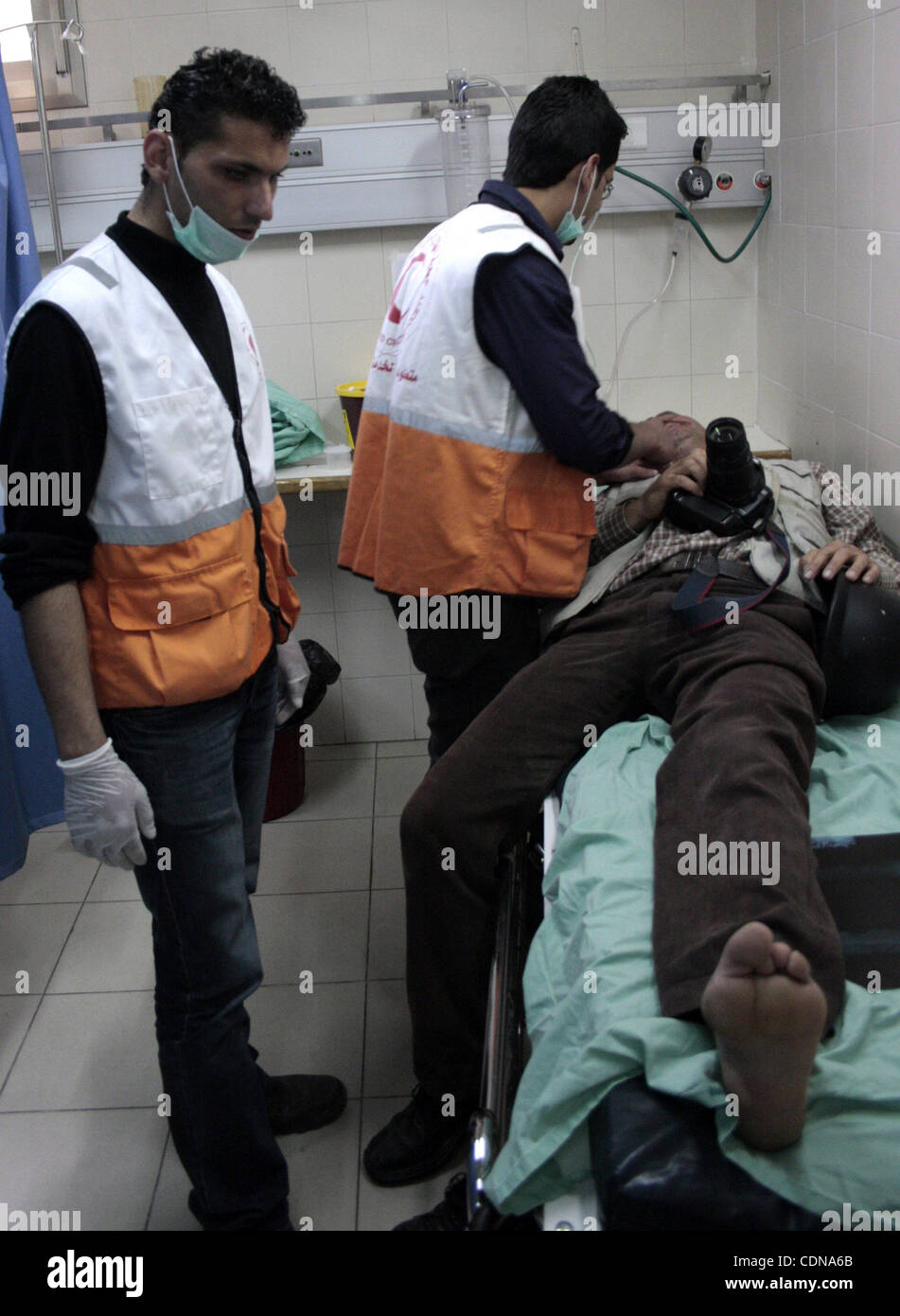 A Palestinian photographer Najeh Hashlamoun receive treatment at a ...