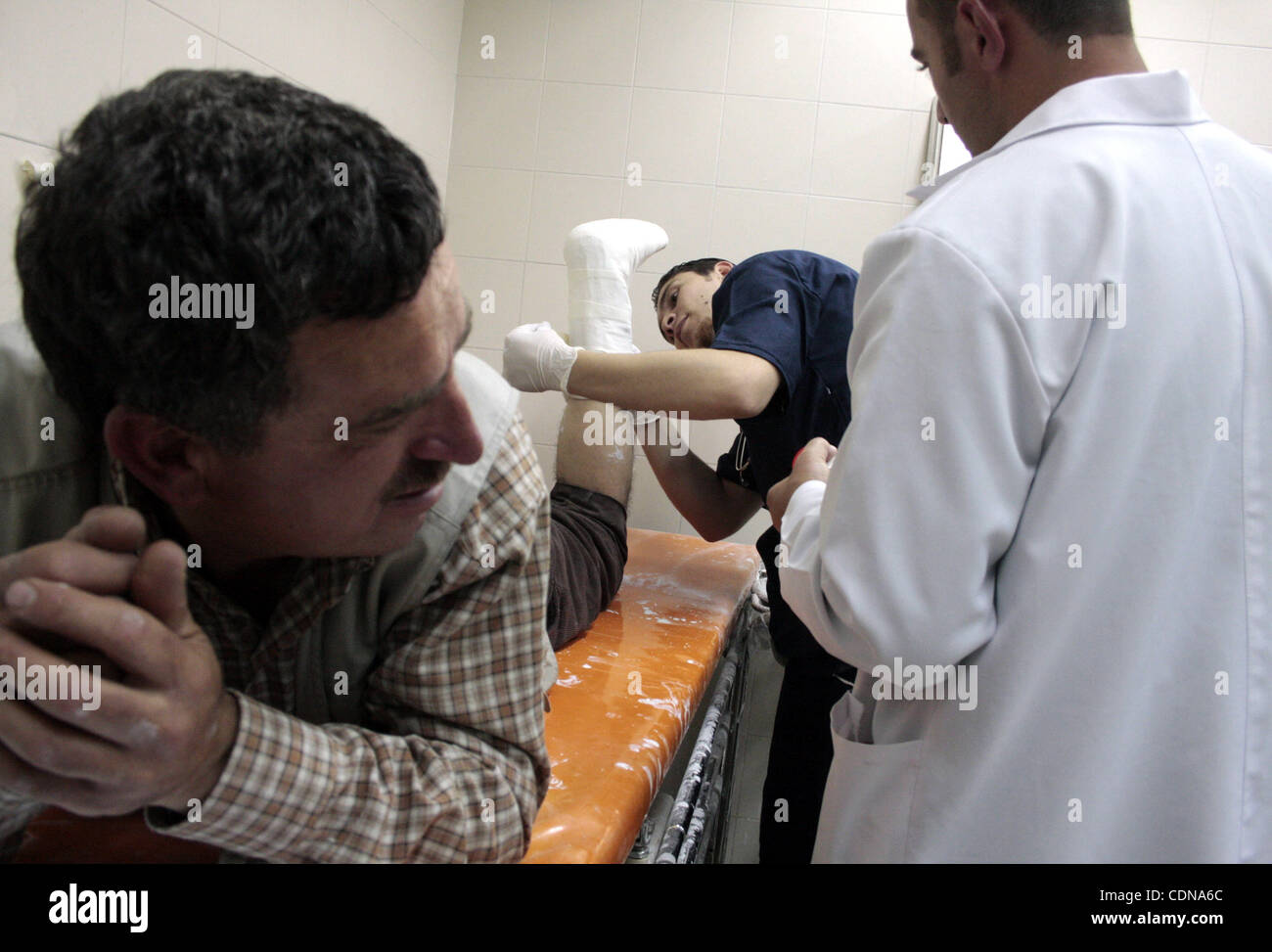 A Palestinian photographer Najeh Hashlamoun receive treatment at a ...