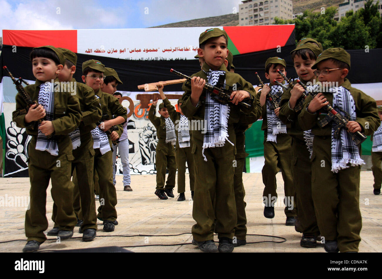 Palestinian children, some of them holding symbolic keys representing ...