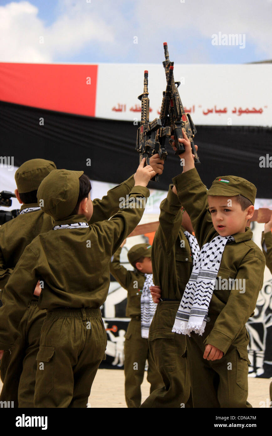 Palestinian children, some of them holding symbolic keys representing ...