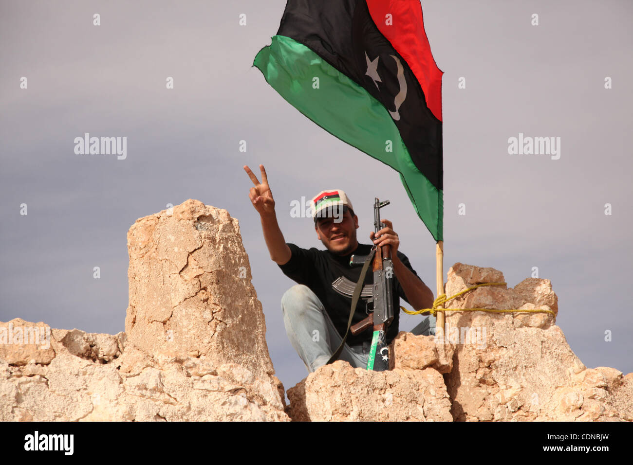 May 19, 2011 - Nalut, Libya - Rebel raising the flag about 2 kilometers ...