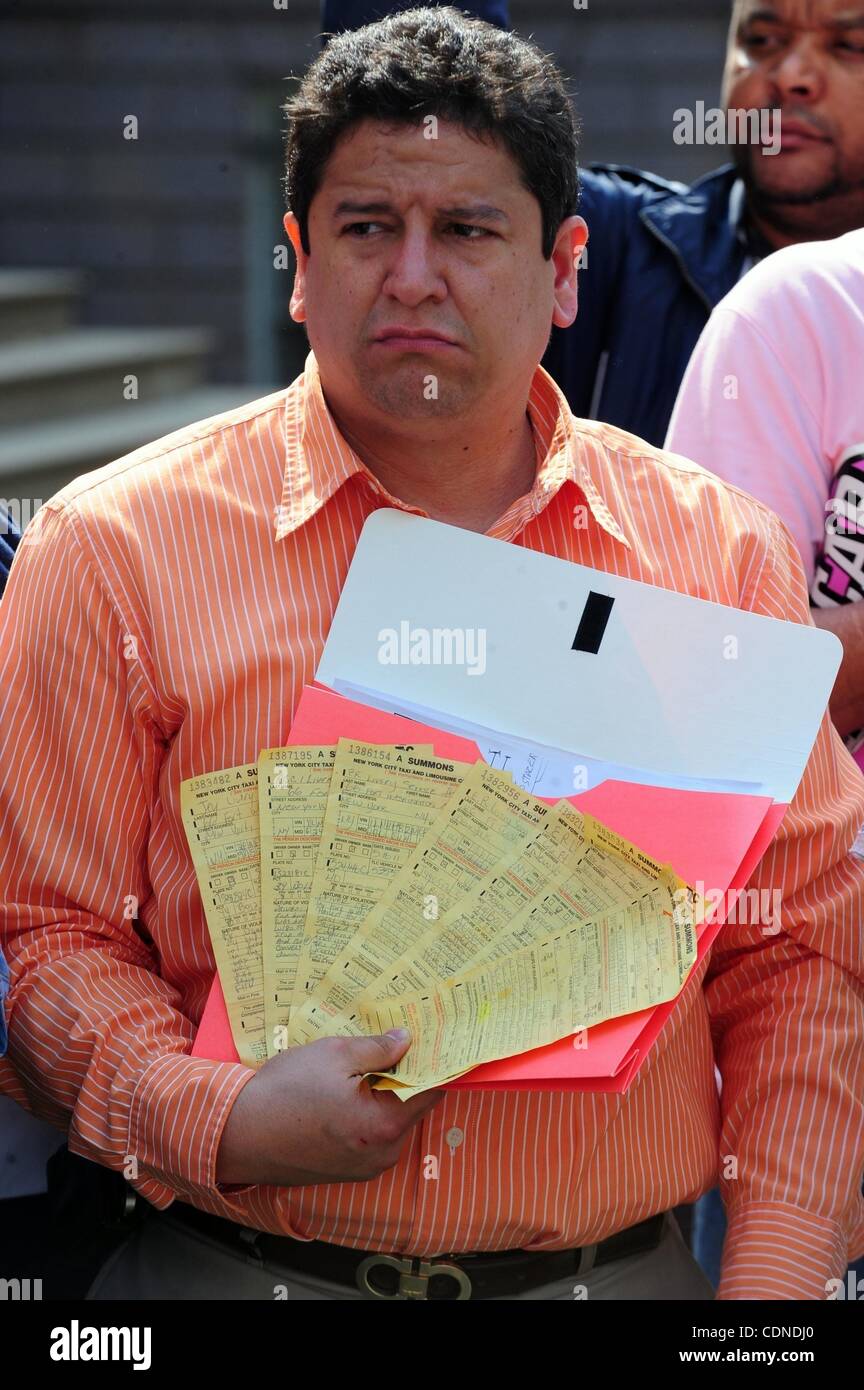 May 26, 2011 - Manhattan, New York, U.S. - A livery driver holds ...