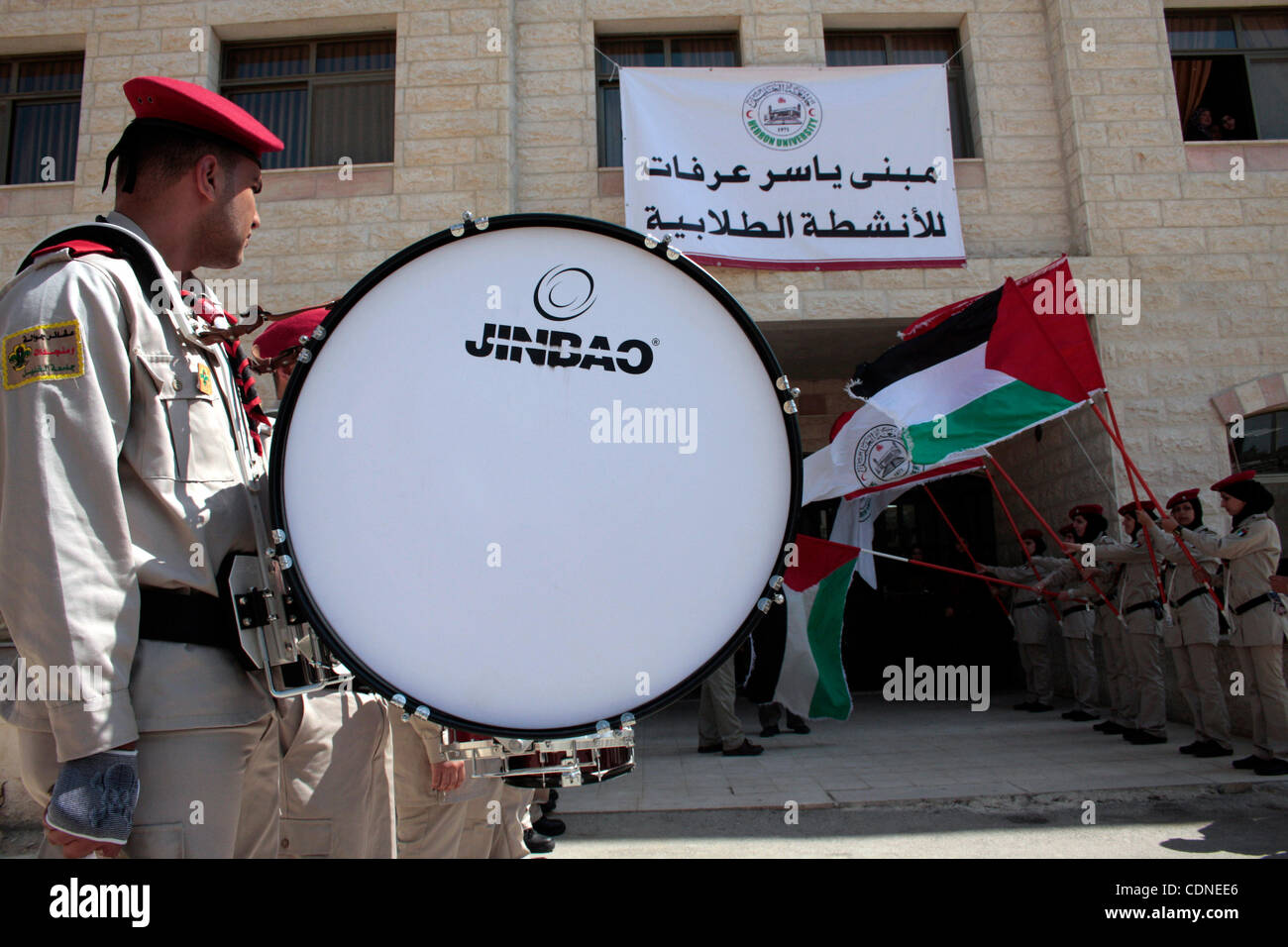 Palestinian scouts hold their national flag as Palestinian prime ...