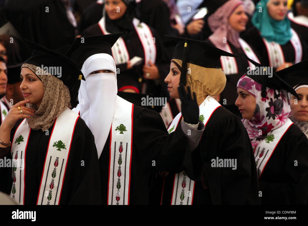 Palestinian students attend their graduation ceremony in Birzeit ...