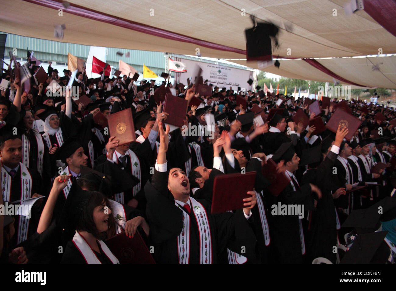 Palestinian students attend their graduation ceremony in Birzeit ...