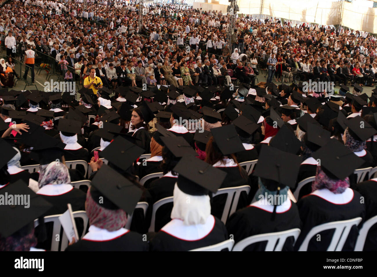 Palestinian students attend their graduation ceremony in Birzeit ...