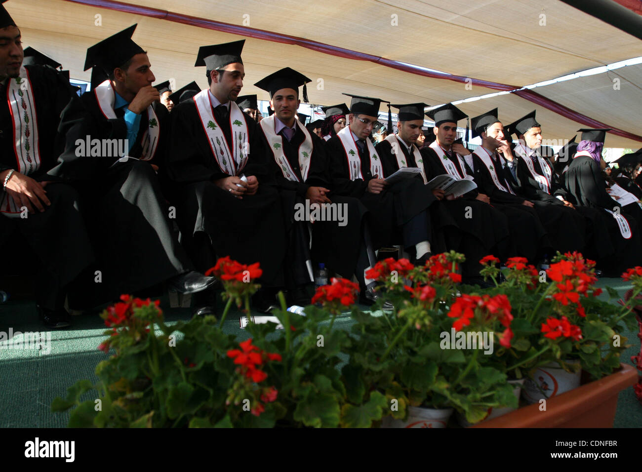 Palestinian students attend their graduation ceremony in Birzeit ...