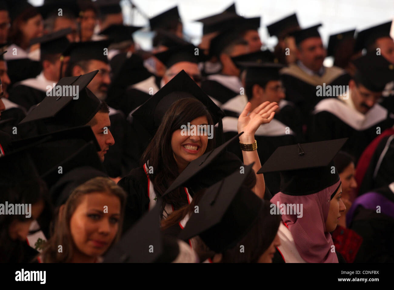 Palestinian students attend their graduation ceremony in Birzeit ...
